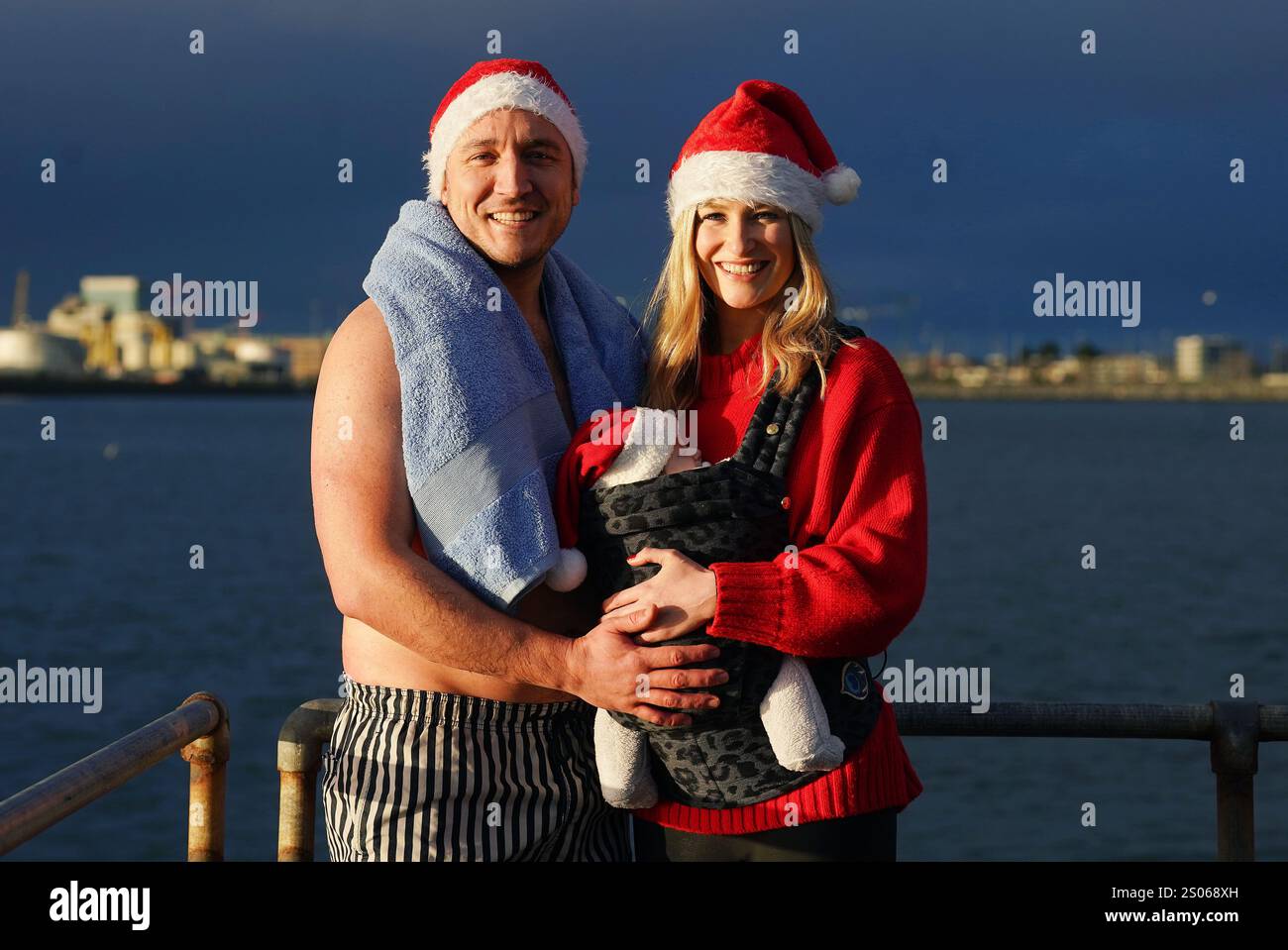 Sean Mulligan (left) and Jill Owens with their ten-week-old daughter ...
