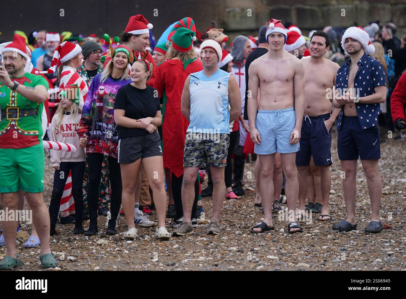People take part in a Christmas Day dip at Hunstanton in Norfolk ...