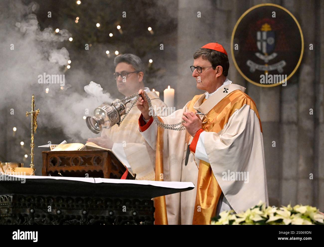 Cologne, Germany. 25th Dec, 2024. Cardinal Rainer Maria Woelki (r ...