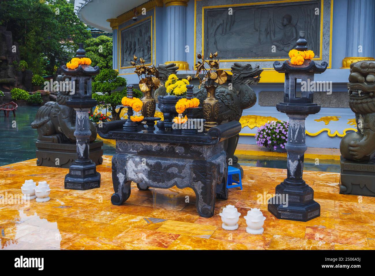 The Asian altar, with colorful floral arrangements on the territory of ...