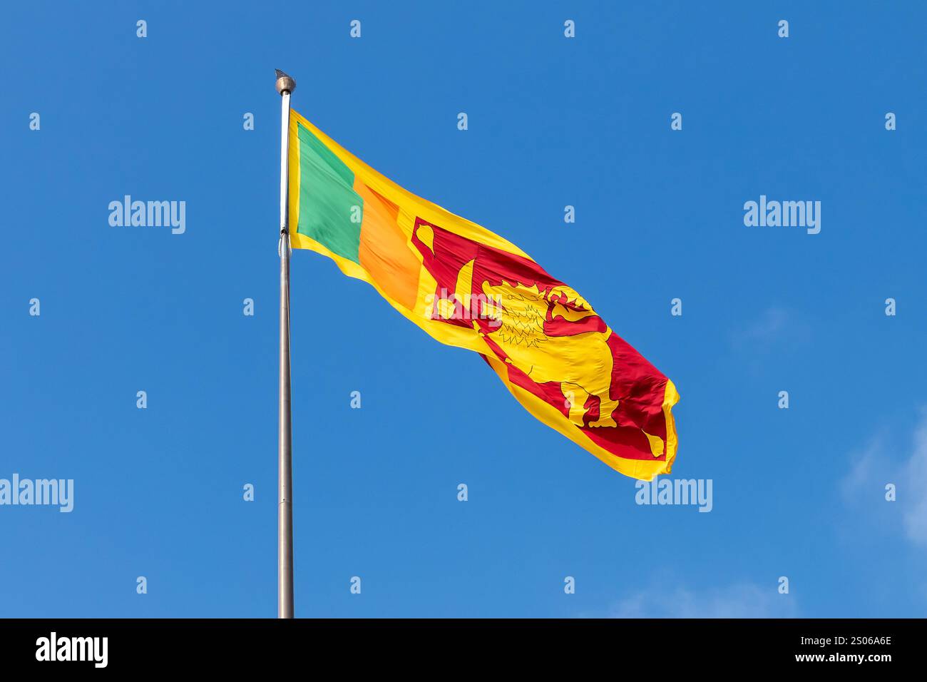 Flag of Sri Lanka or the Sinha Flag is on a flagpole under blue sky on ...