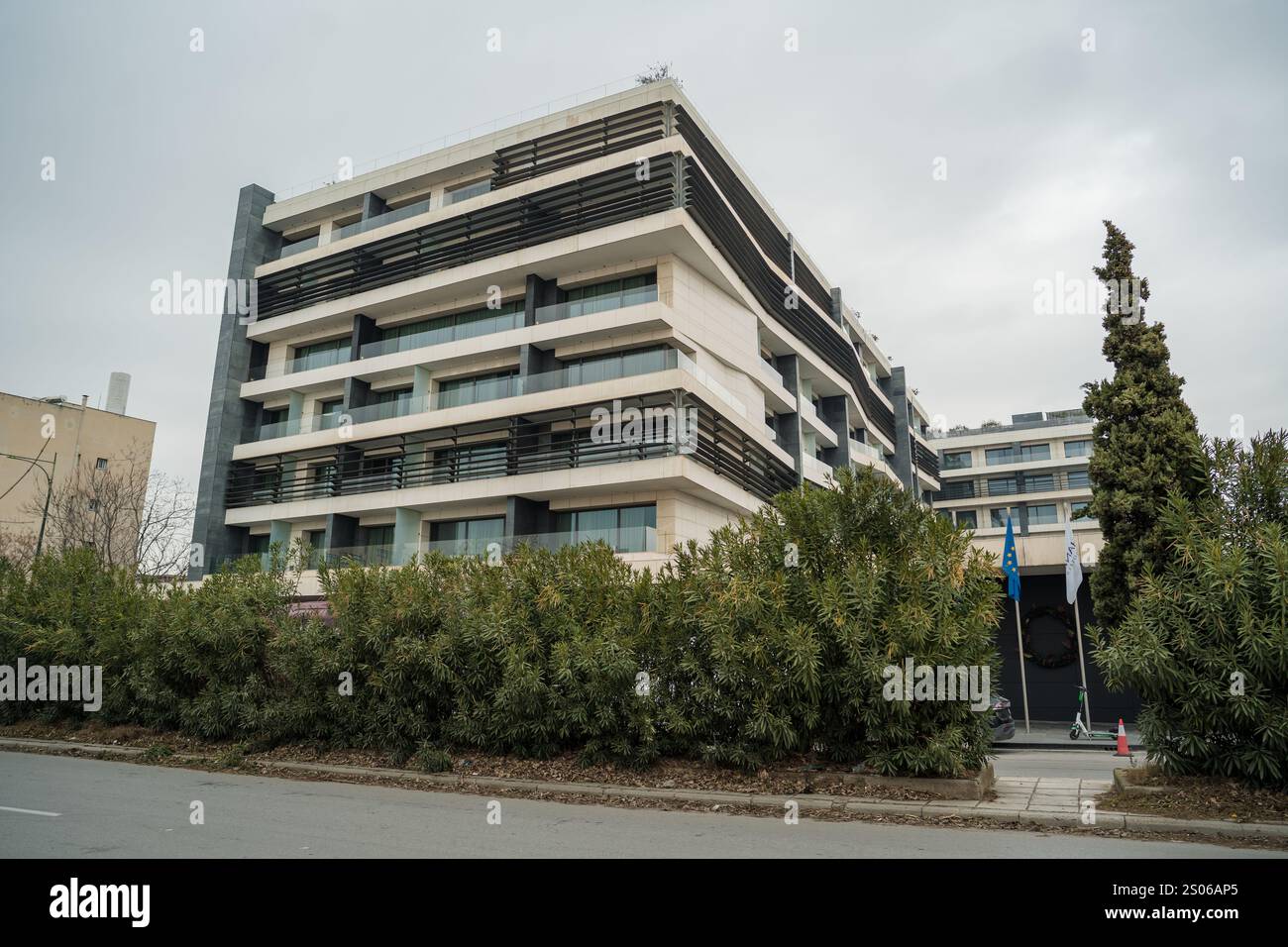 A contemporary multi-story office building with minimalist ...