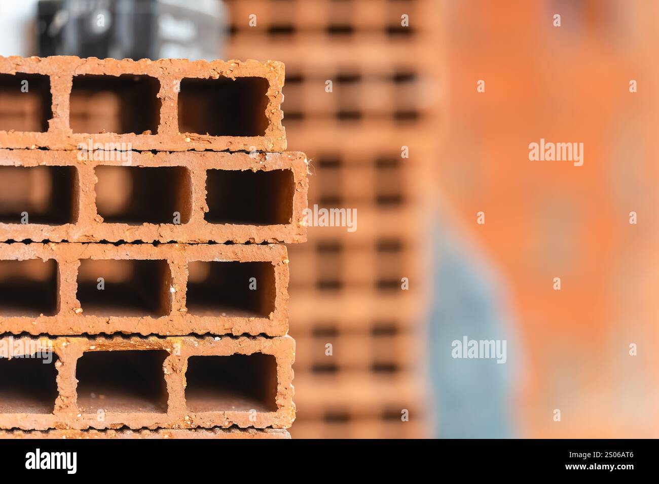 Pile of flat bricks for wall construction in masonry works Stock Photo ...
