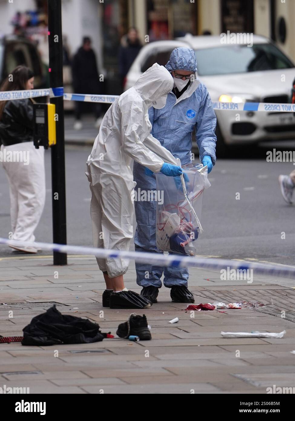 Forensic investigators collect evidence at the scene on Shaftesbury ...