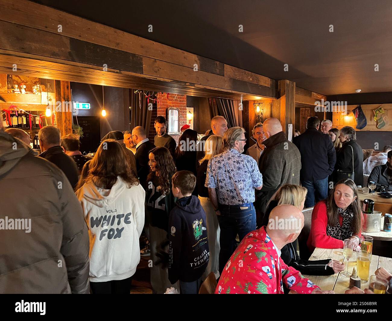 People enjoy a pre-Christmas Lunch drink in the mild weather at the ...