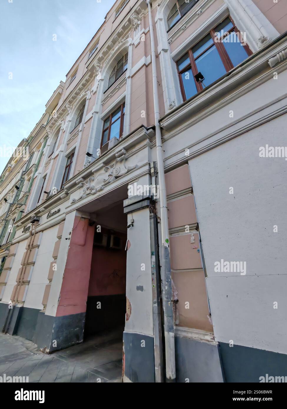 historical pink building with multiple floors, adorned with decorative ...