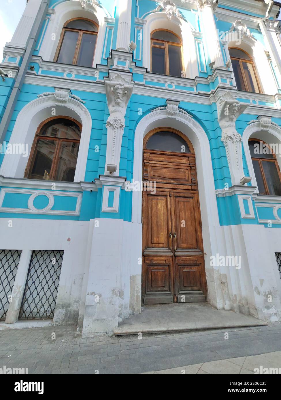 Ornate architectural details on a brightly colored historic building ...