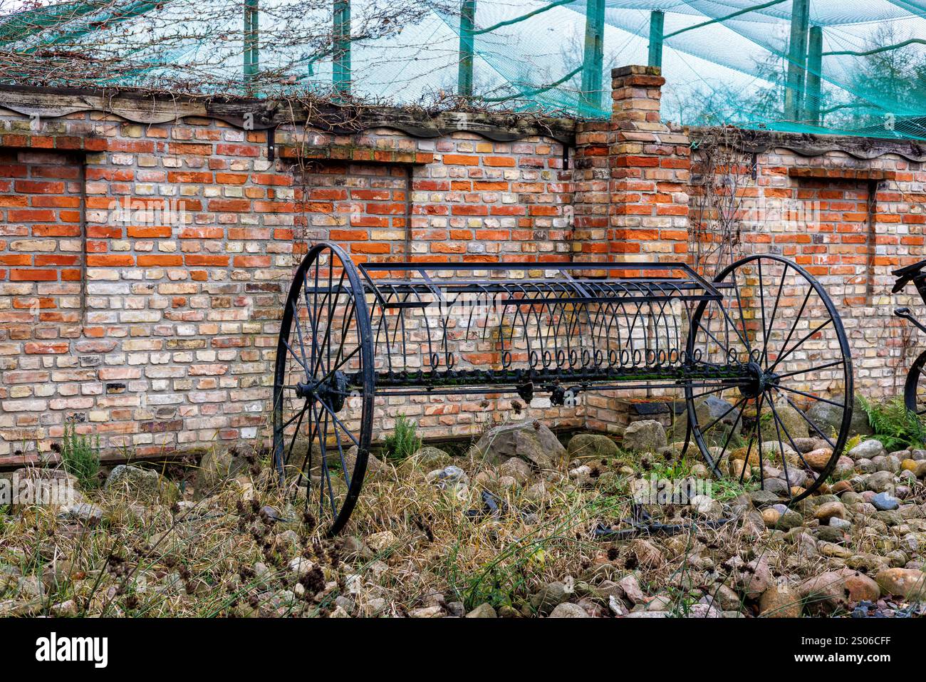 Antique mechanical rake for collecting hay with large wheels Stock ...
