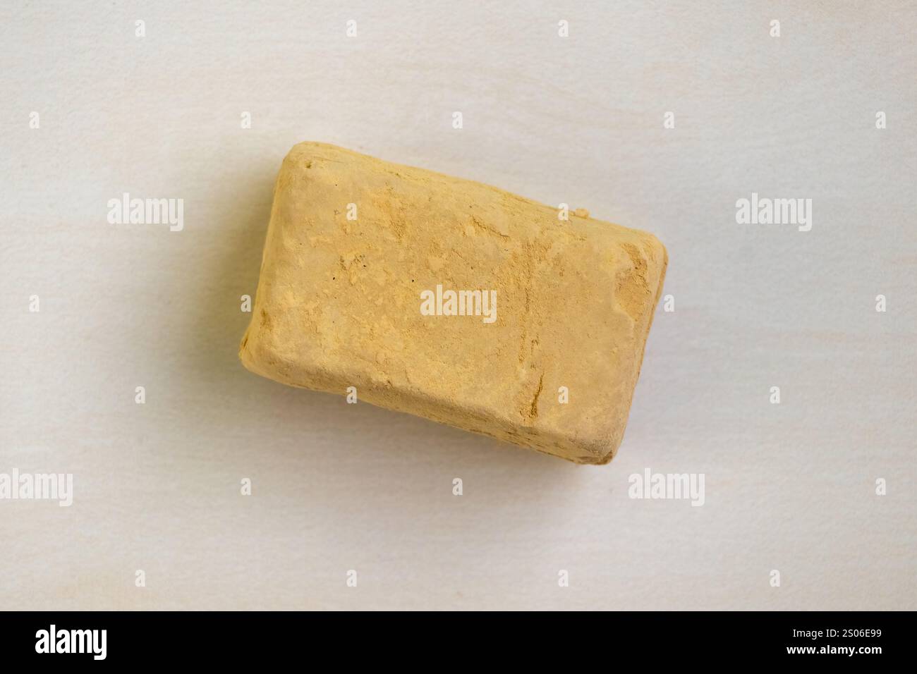 A piece of Multani Mitti, a natural clay also known as Fuller's Earth ...