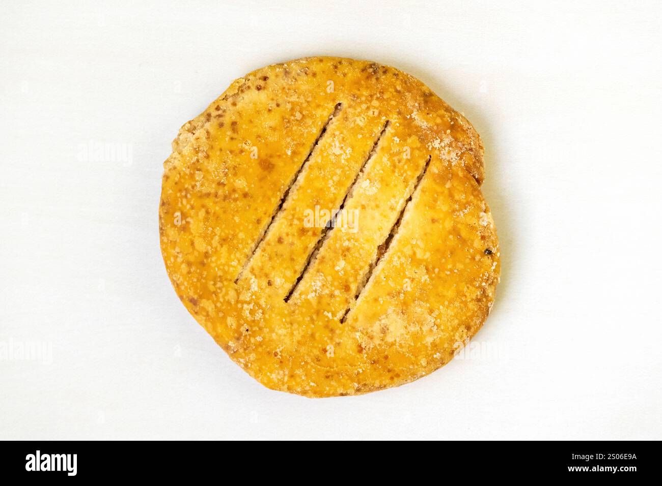 A crispy Bakarkhani, isolated on a white background. This iconic thick ...