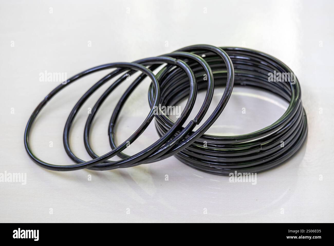 Black glass bangles, isolated on a white background. A popular beauty ...