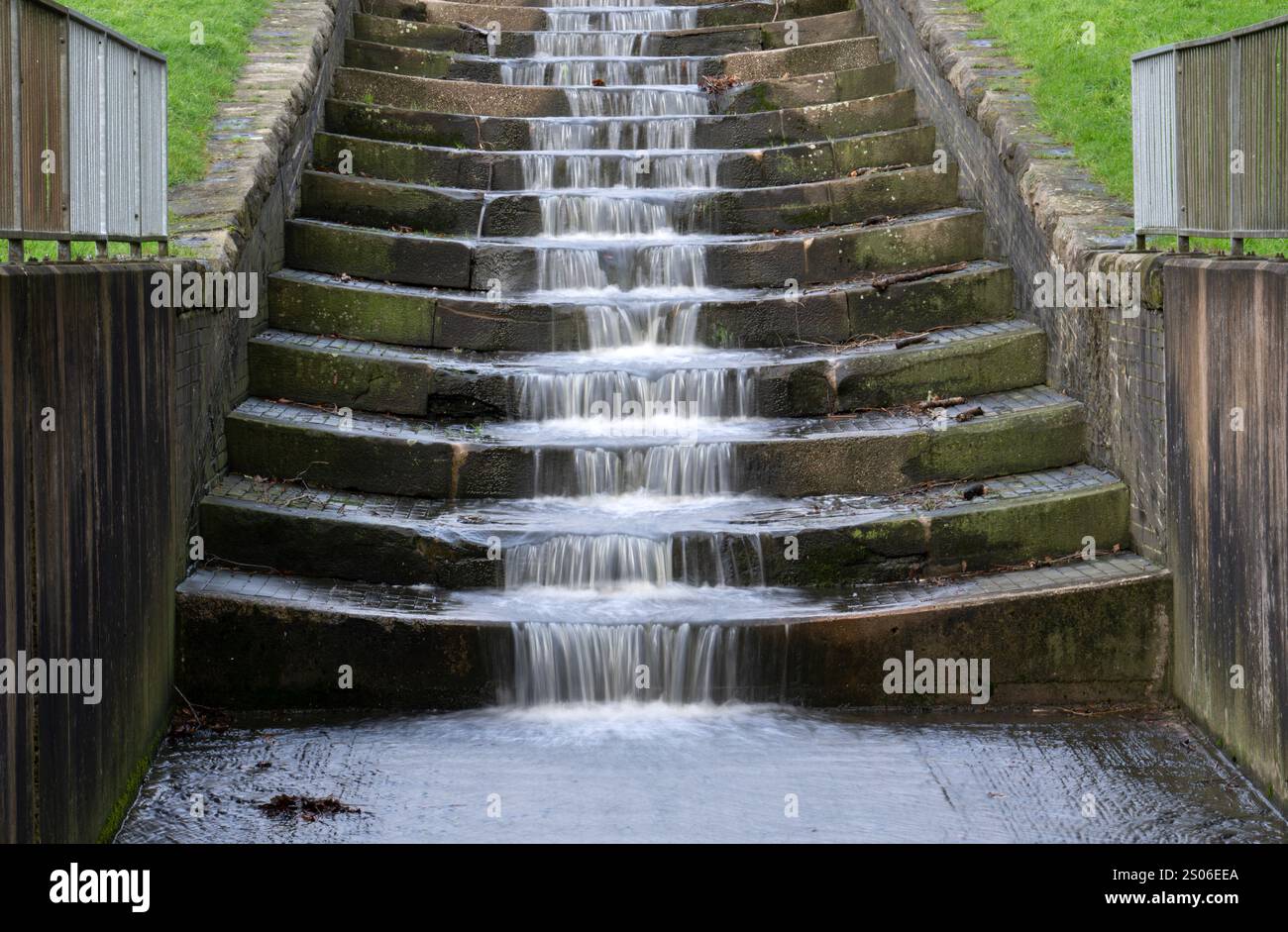 Water flowing down Carr Mill Dam steps on the outskirts of St Helens in ...