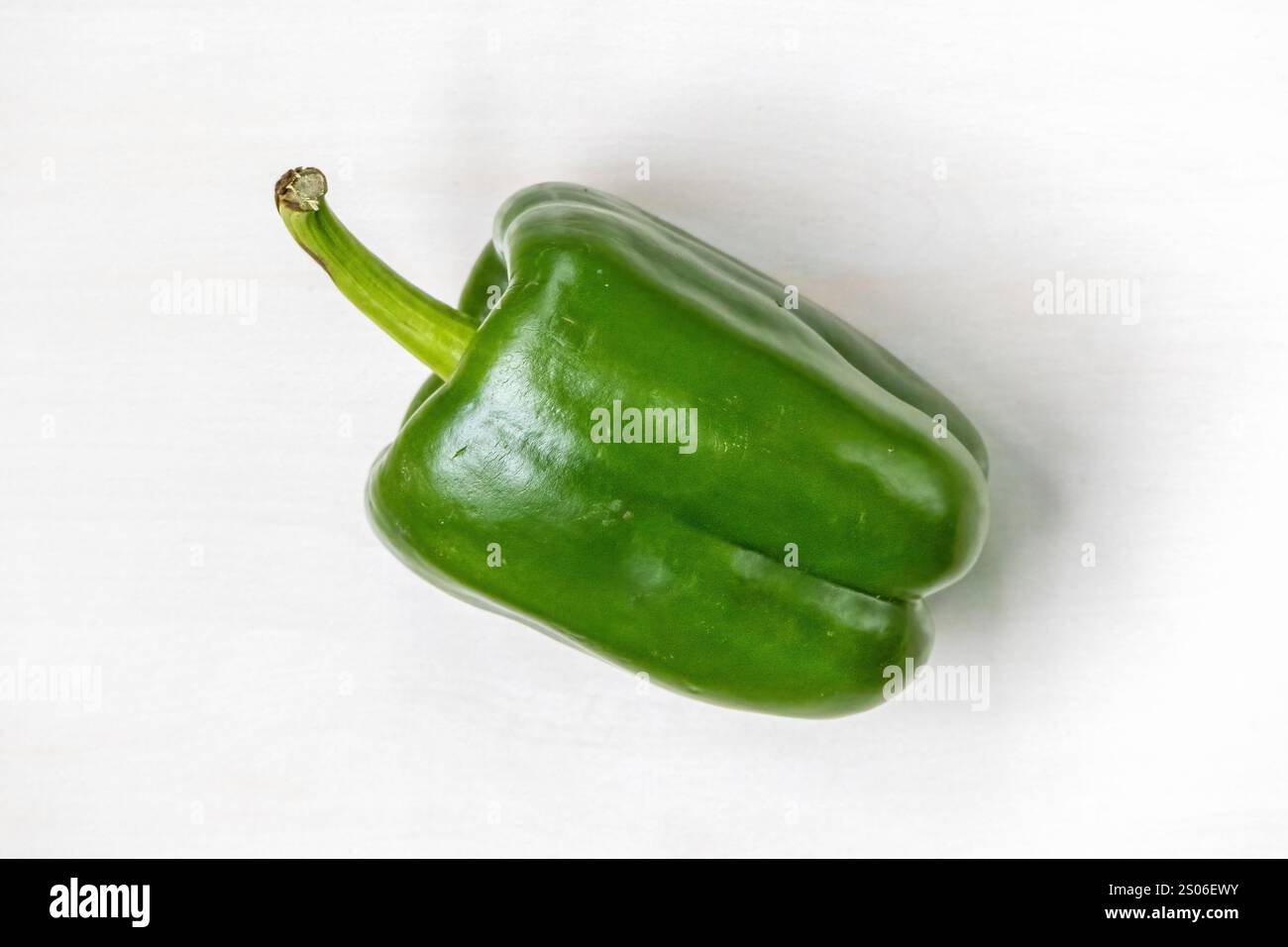 Top view of a fresh green bell pepper isolated on white background. It ...
