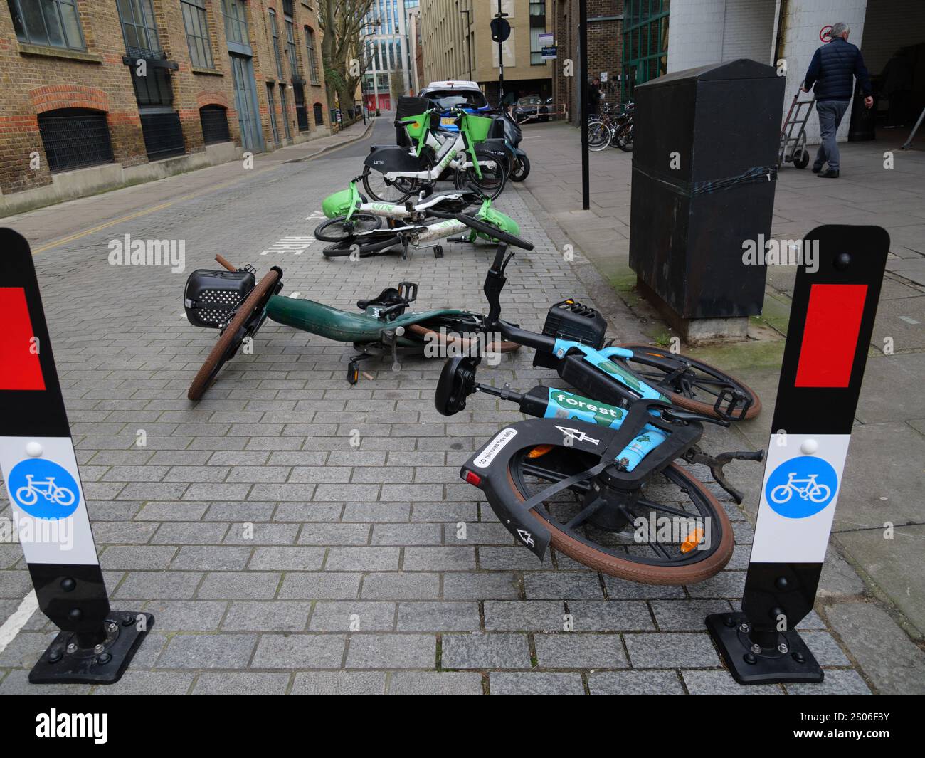 London, UK. Discarded e-bikes in the hire bay pose a hazard to ...