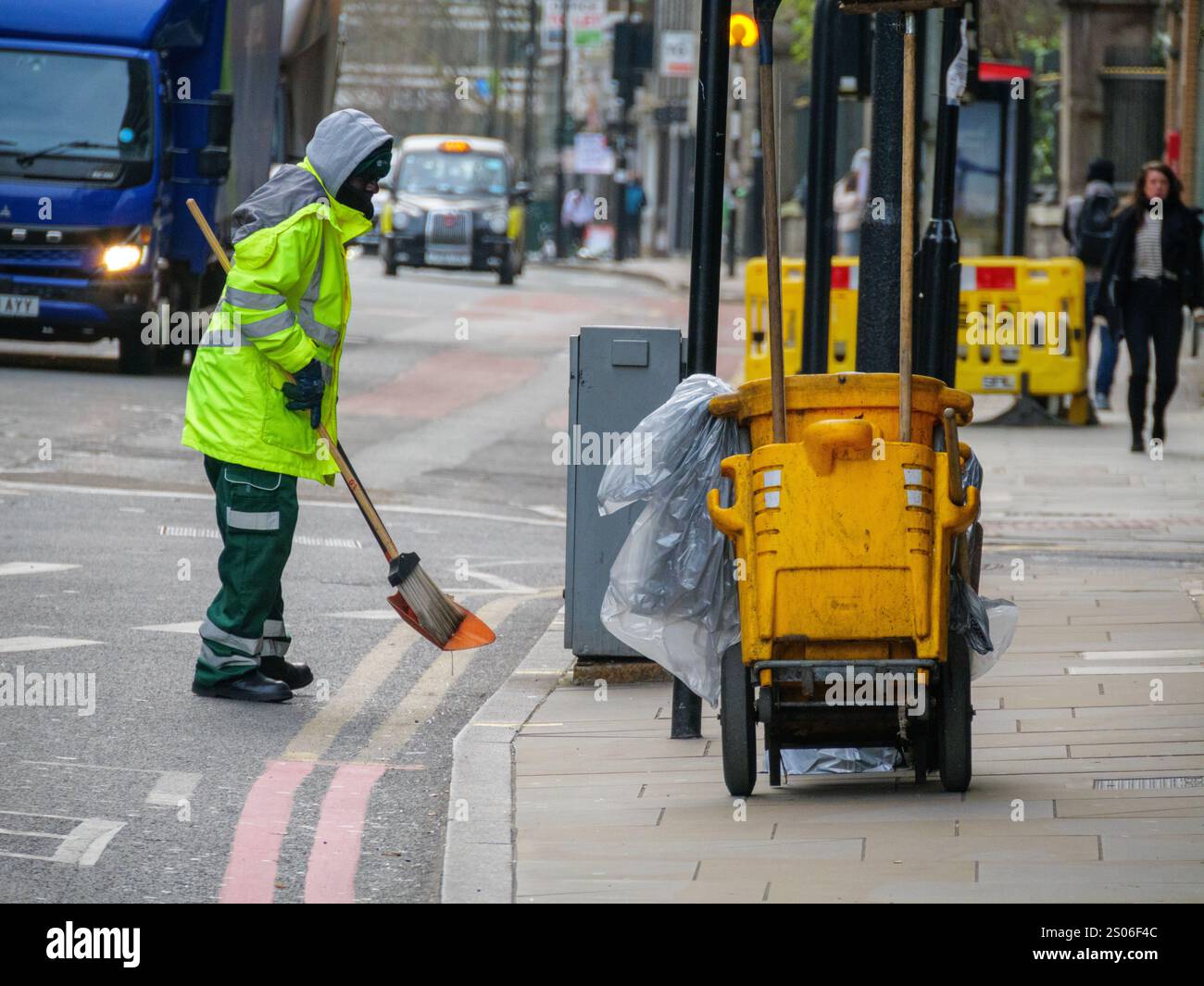 Road sweeping cleaning pavements and roads in City Road, City of London ...