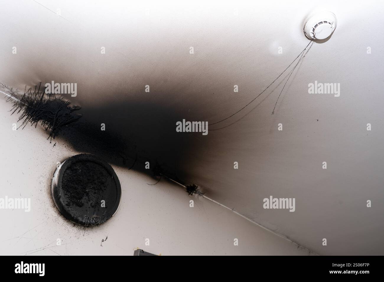 Burnt out LED lamp. A lampshade lamp on the wall after a fire ...