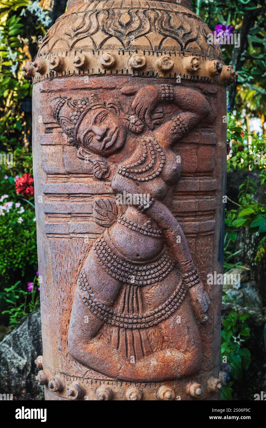 sculpture statue of a female deity on a Buddhist pagoda in Asia in ...