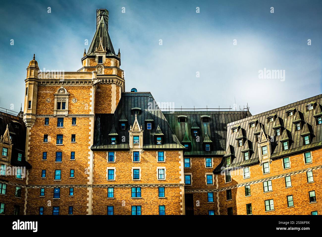 A large building with a steeple and a lot of windows. The building is ...