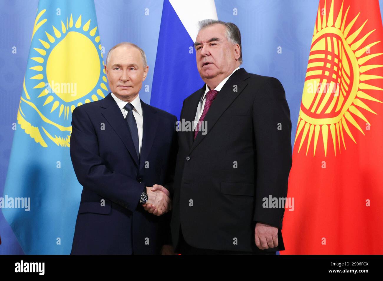 Russian President Vladimir Putin, left, and Tajik President Emomali ...