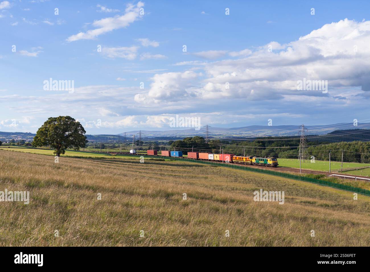 2 Freightliner class 90 electric locomotives pass Strickland, Cumbria ...
