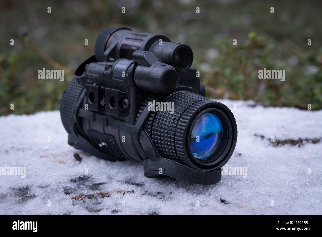 Modern military night vision monocular of the 3rd generation on a stump ...