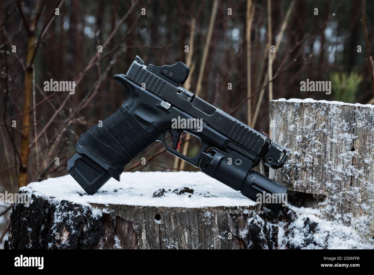 Tactical 9mm pistol with red dot sight, muzzle brake, flashlight in ...