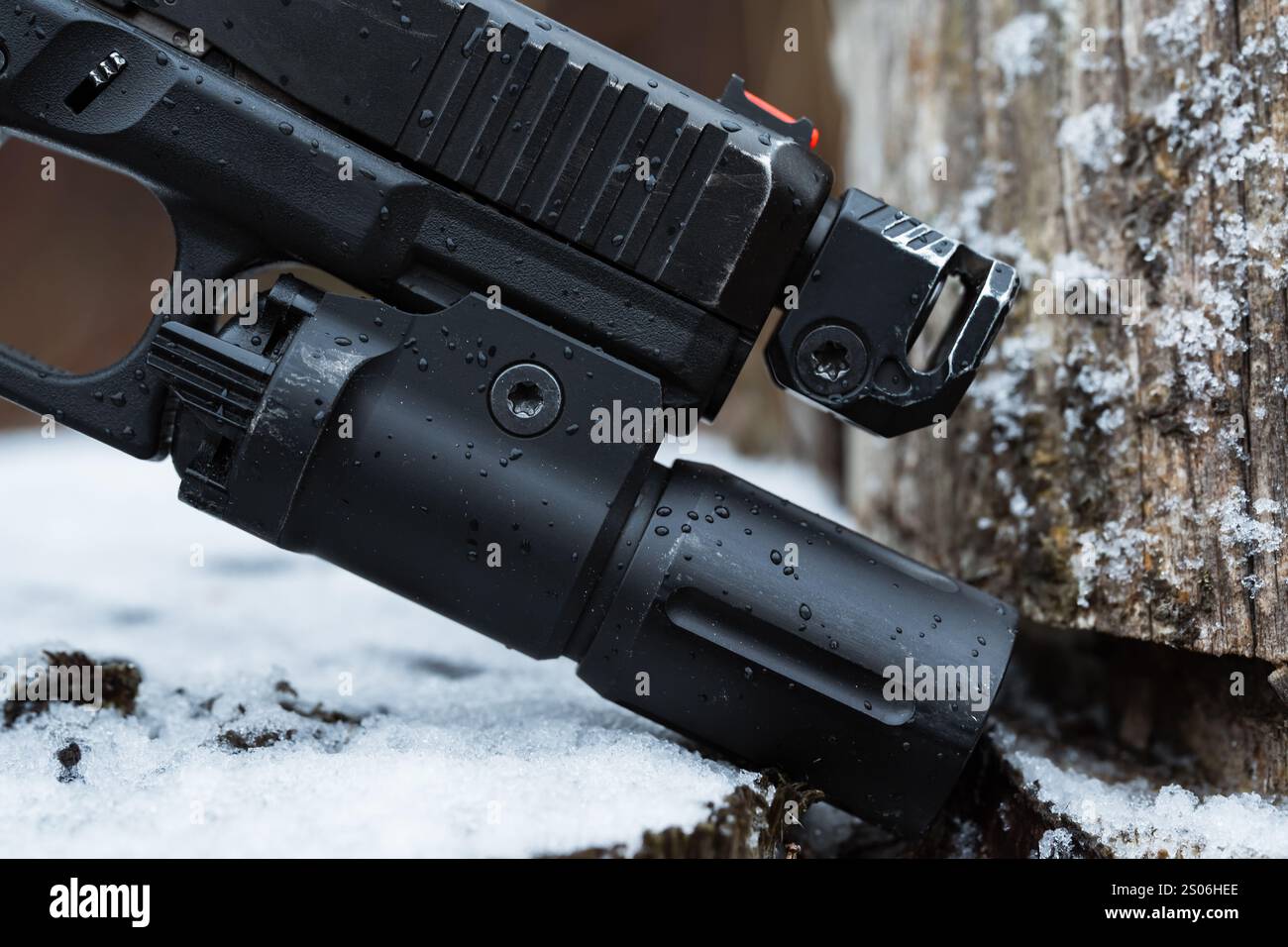 Tactical gear, powerful weapon flashlight mounted on a pistol, macro ...