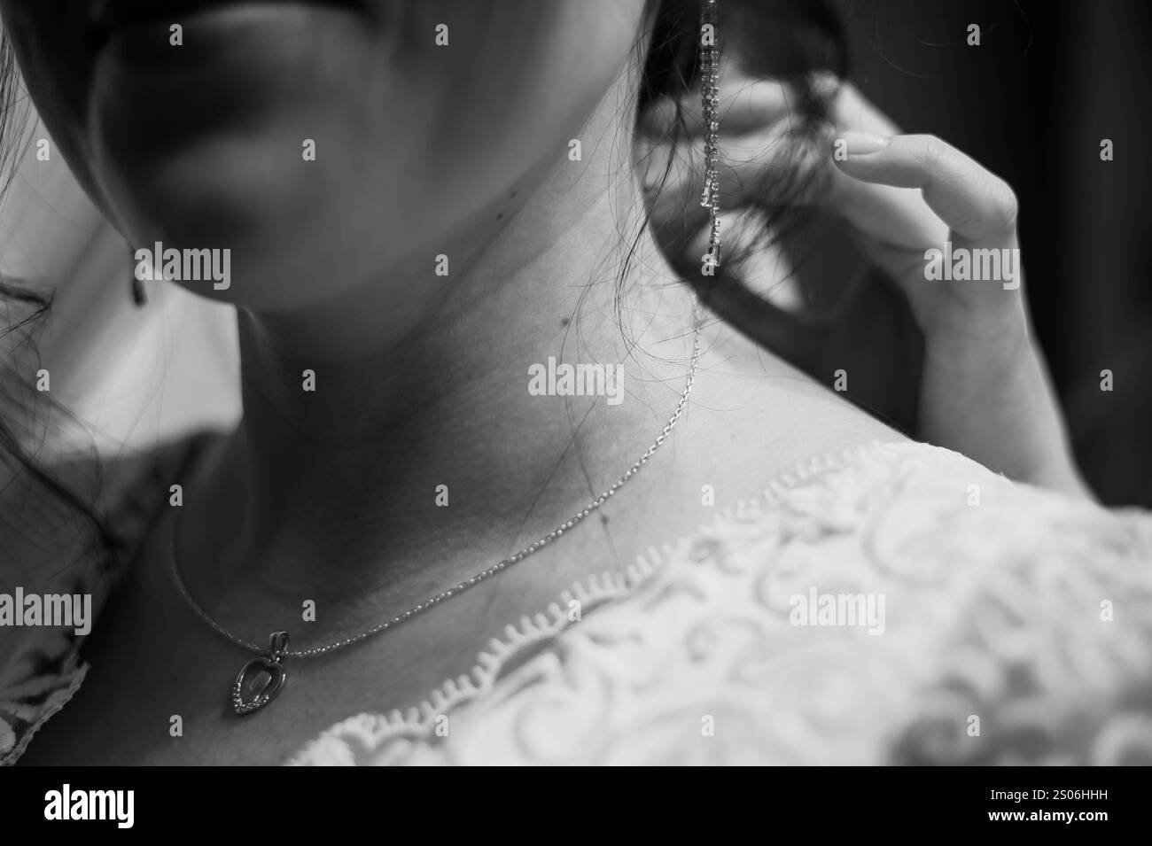 Intimate Moment of Jewelry Adornment in Elegant Black and White Stock ...