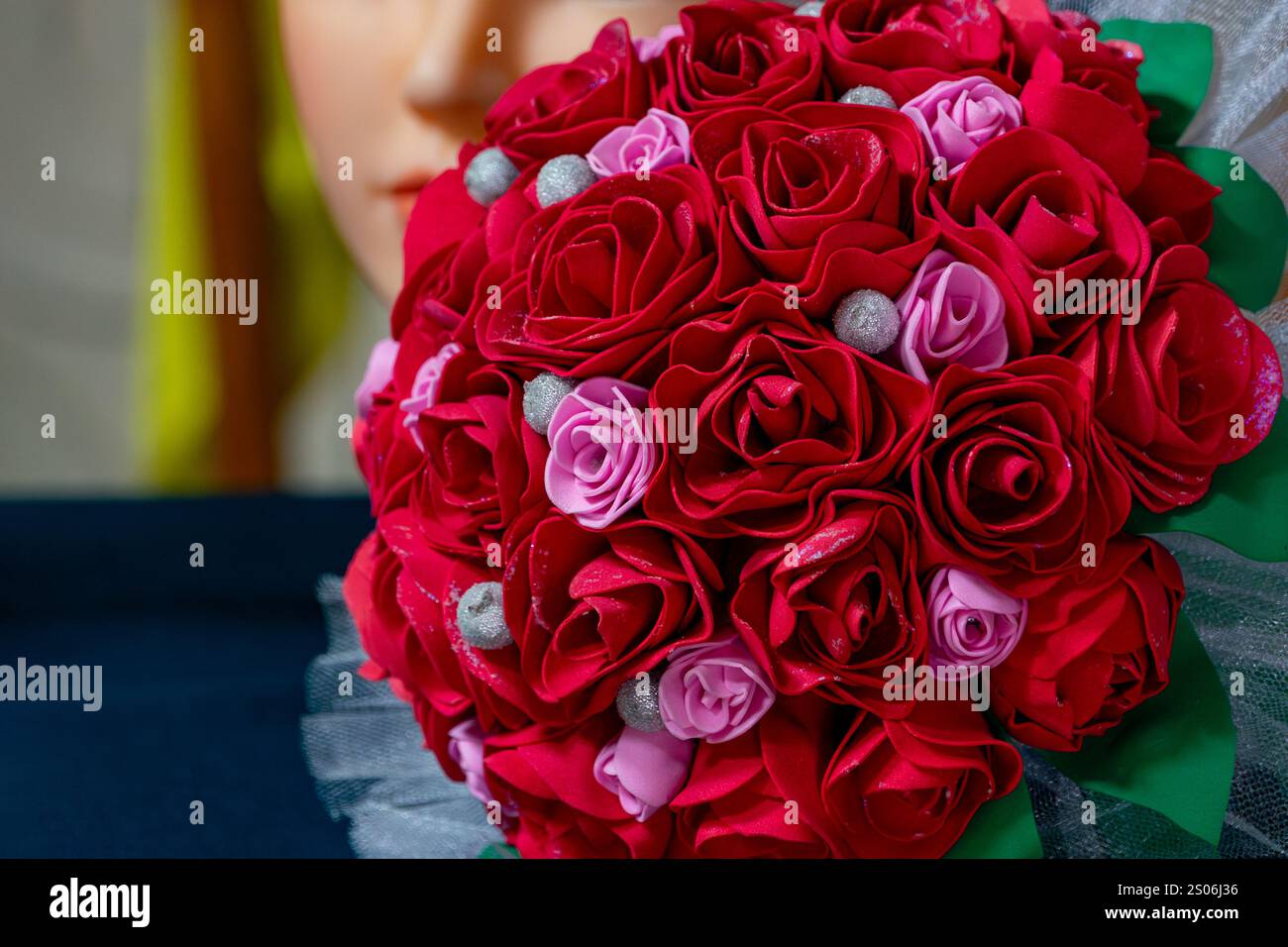 Crafted from vibrant materials, this stunning bouquet features rich red ...