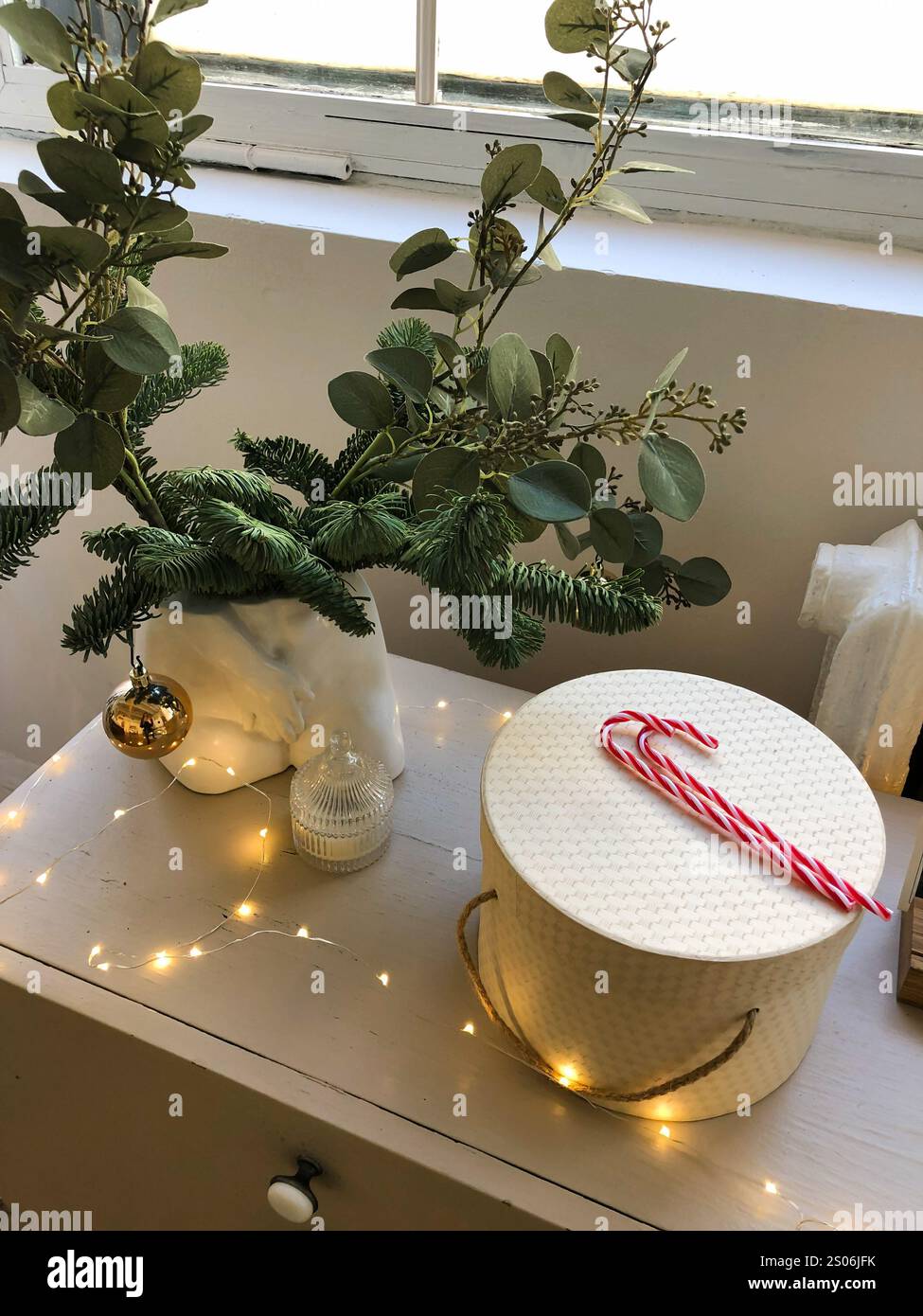 This elegant winter setup showcases a minimalist yet festive ...