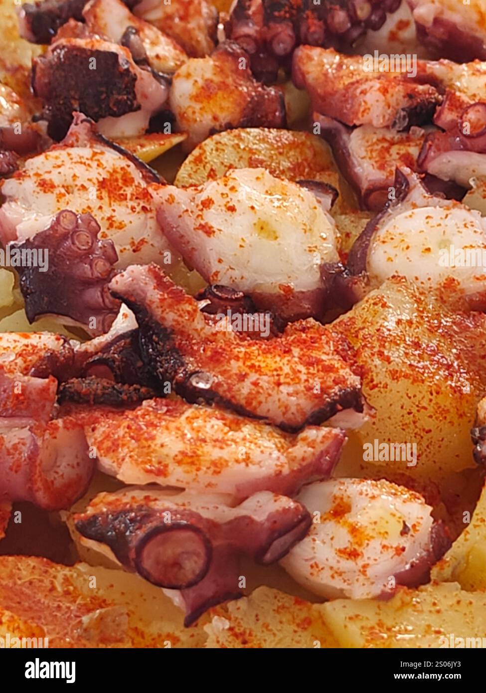 Spanish pulpo Dish on traditional wooden plate Stock Photo - Alamy