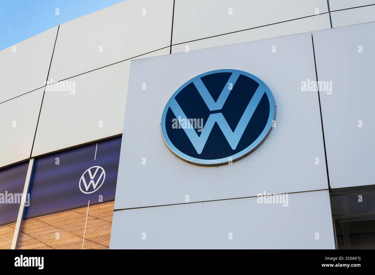 New Volkswagen company logo on dealership building on November 28, 2024 ...