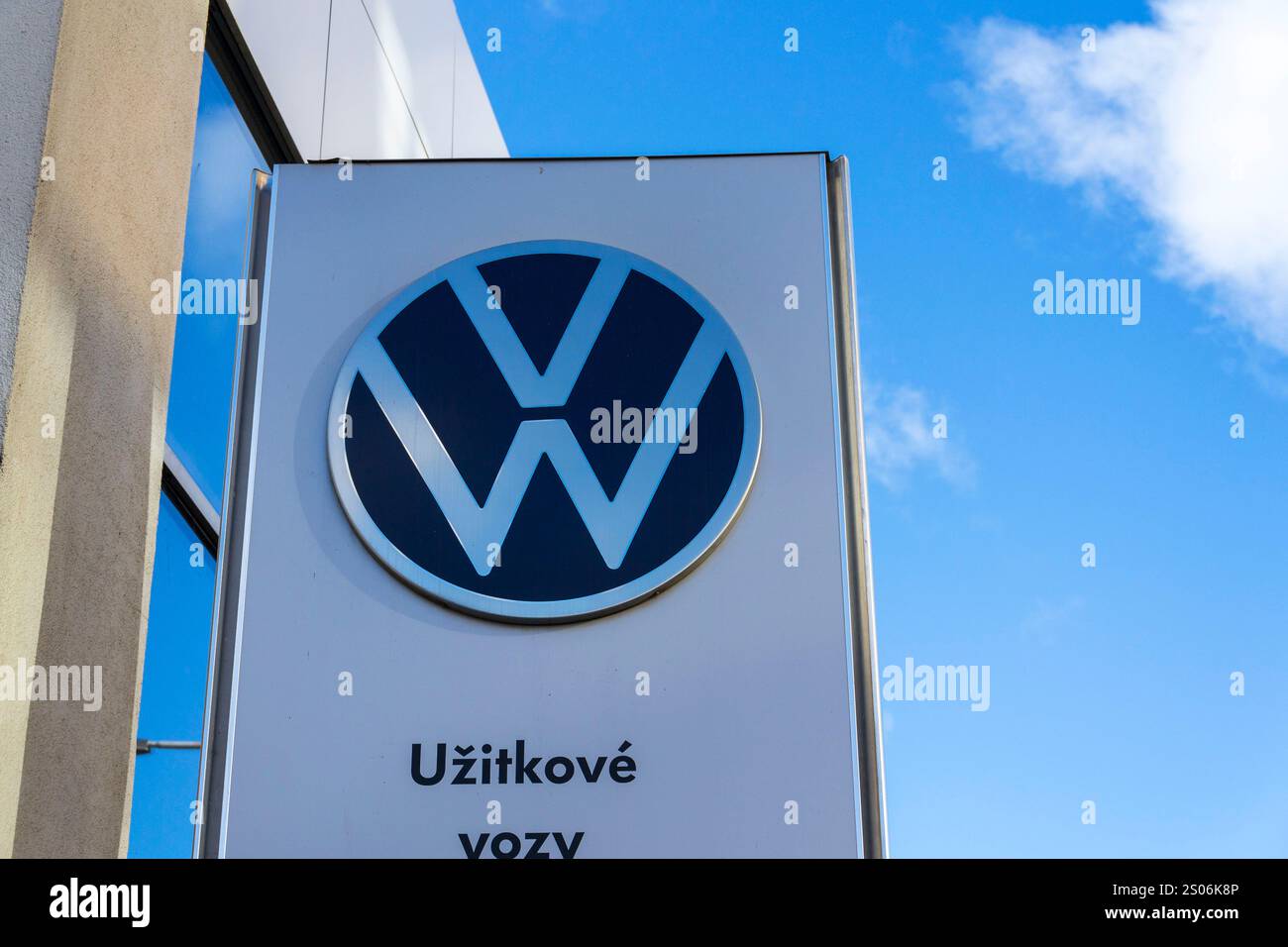 New Volkswagen company logo on dealership building on November 28, 2024 ...
