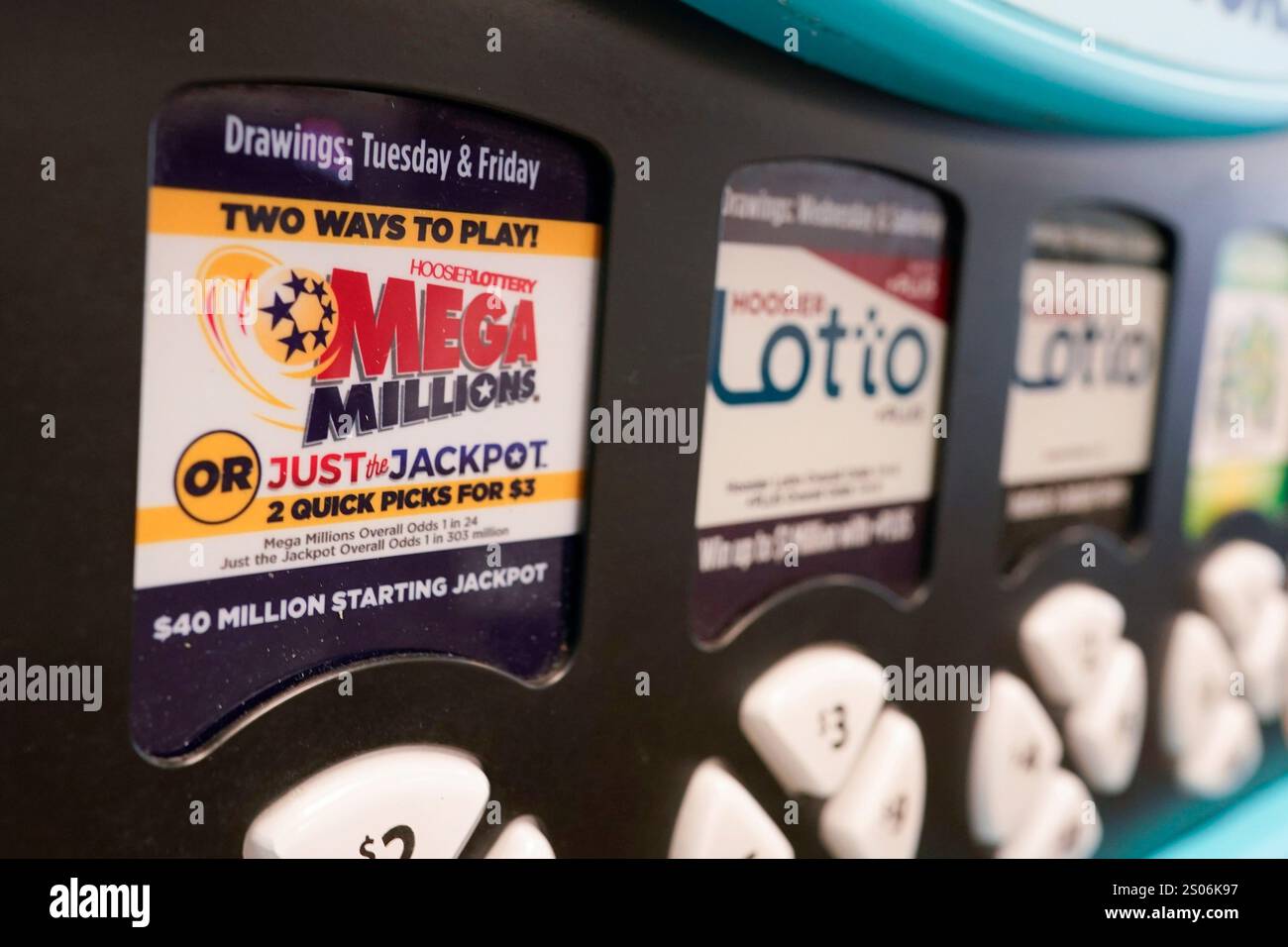 FILE - A Mega Millions logo is displayed on a vending machine at the ...