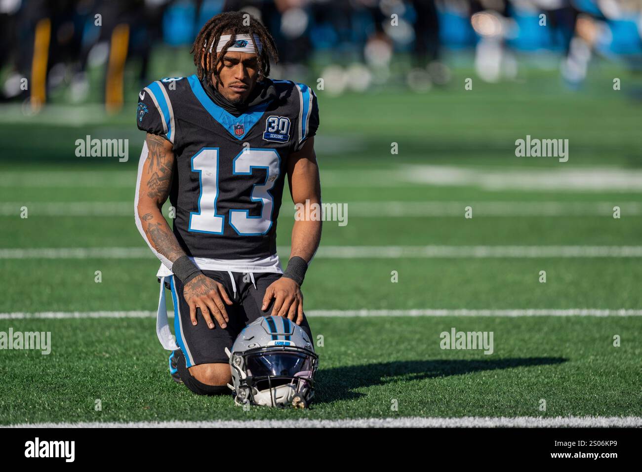 Carolina Panthers wide receiver Deven Thompkins (13) kneels before an ...