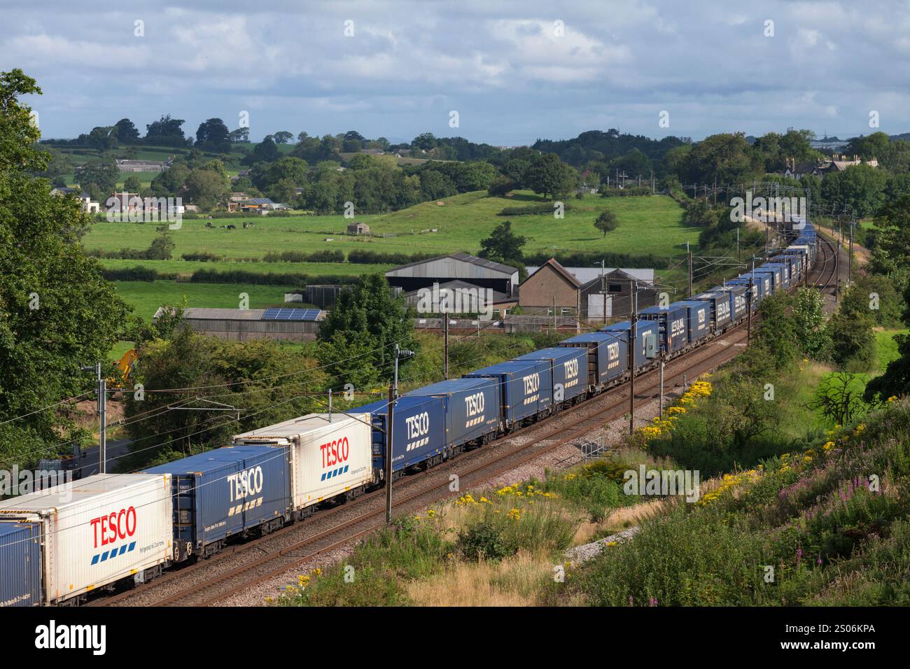 Freight train carrying intermodal containers for Tesco on the west ...