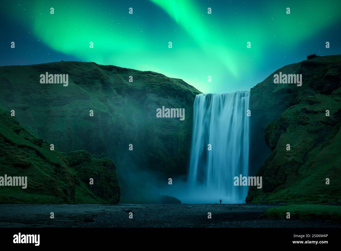 Aurora Borealis over famous Skogafoss waterfall on Skoga river, Iceland ...
