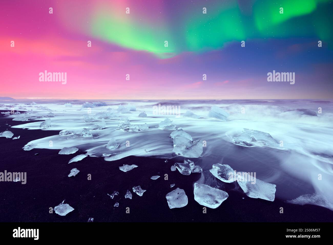 Aurora Borealis and iceberg pieces over black Diamond beach near ...