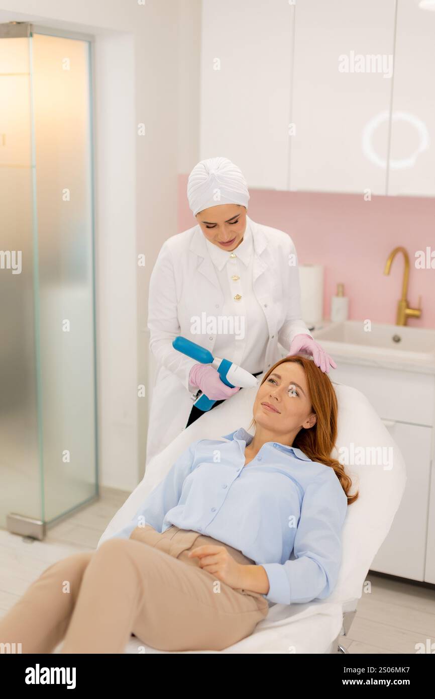 A skilled practitioner delivers CO2 skin cooling therapy to a relaxed ...