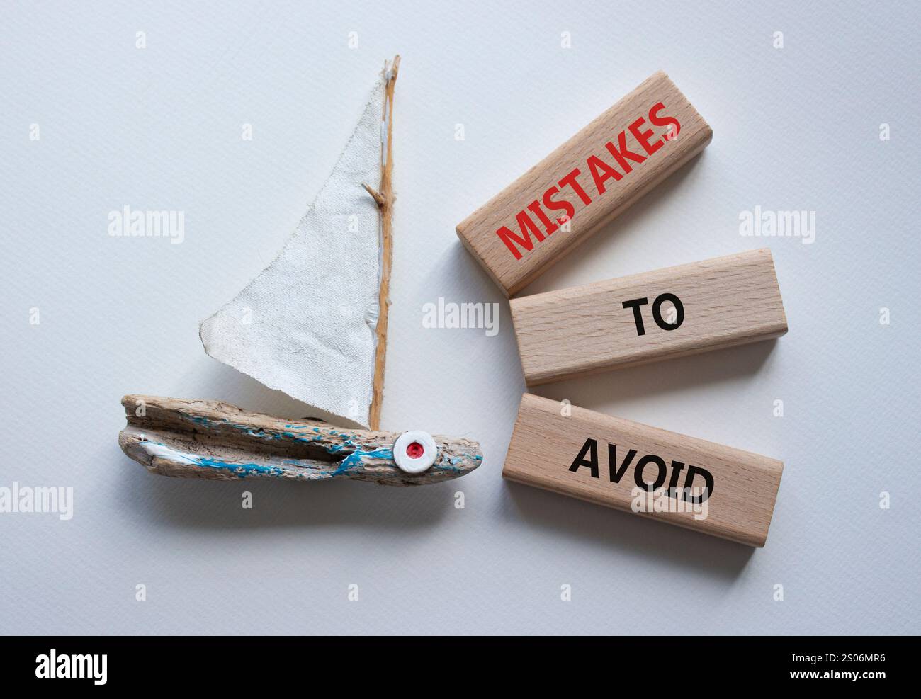 Mistakes to Avoid symbol. Wooden blocks with words Mistakes to Avoid ...