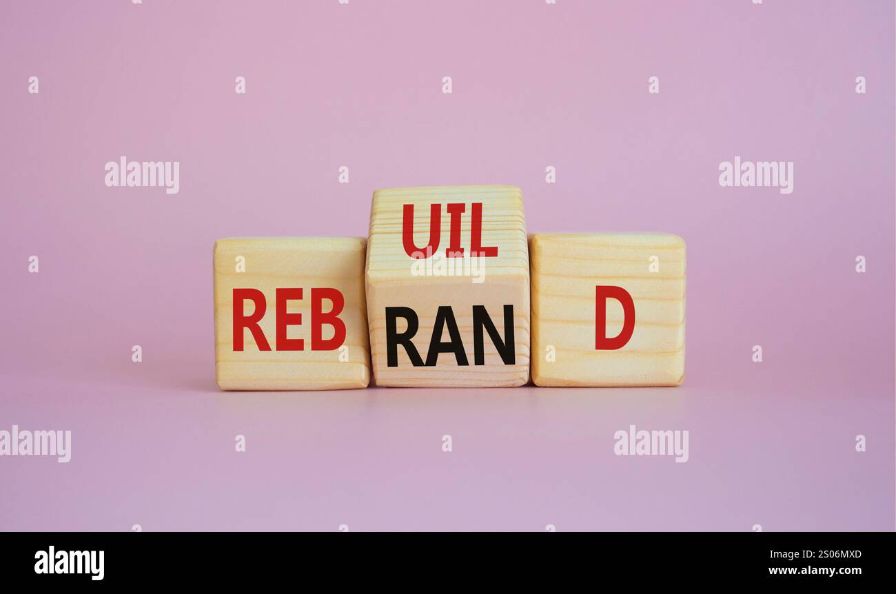 Rebuild and Rebrand symbol. Wooden cubes with words Rebrand and Rebuild ...