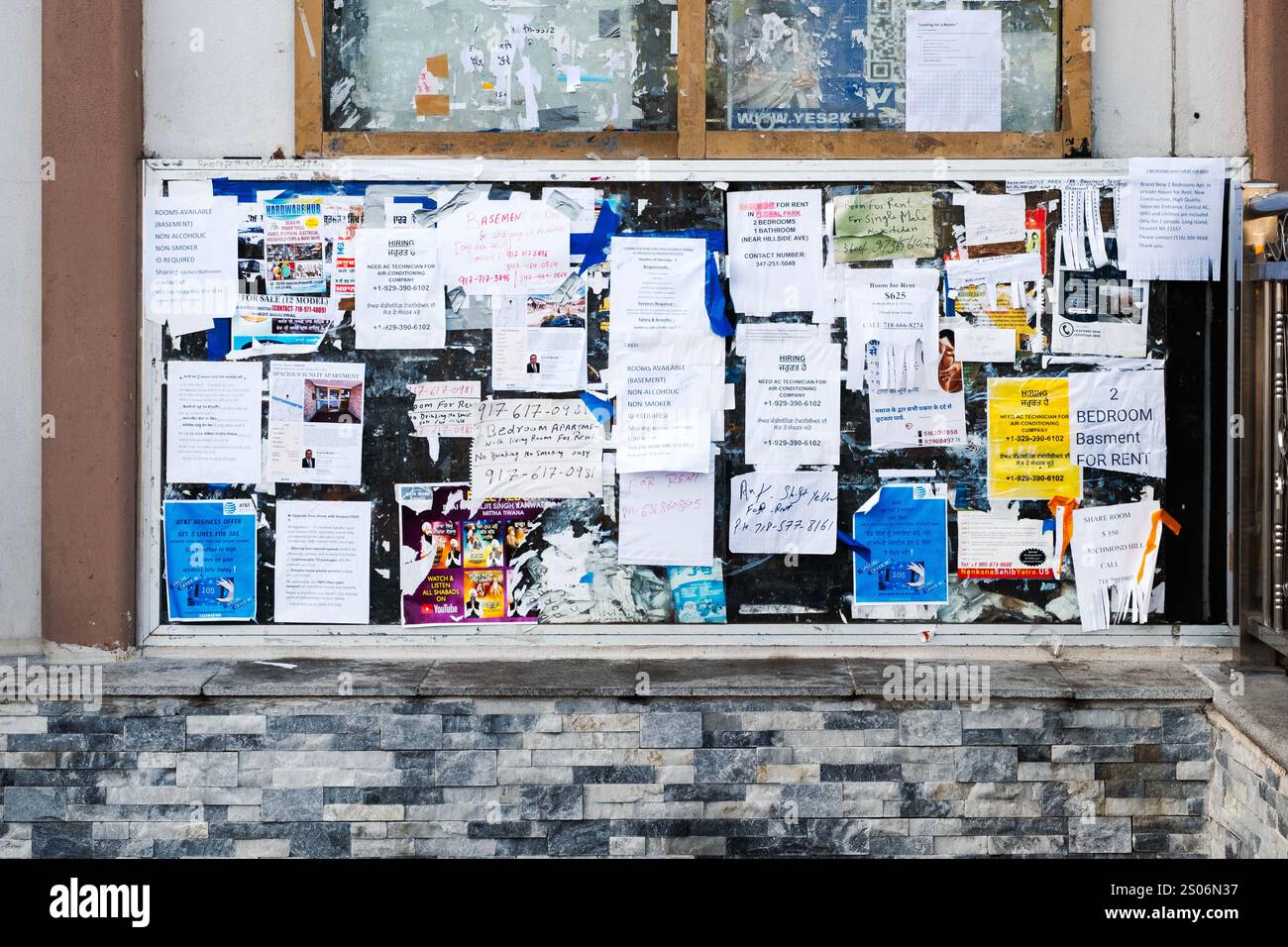 A community bulletin board with messages largely hand written & about ...