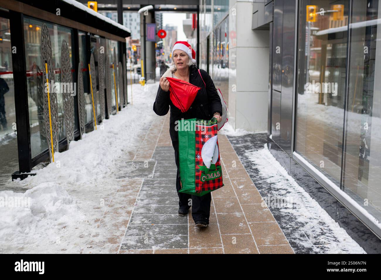 Shawna Thibodeau, of Shawna's Outreach, pulls out a Christmas stocking ...