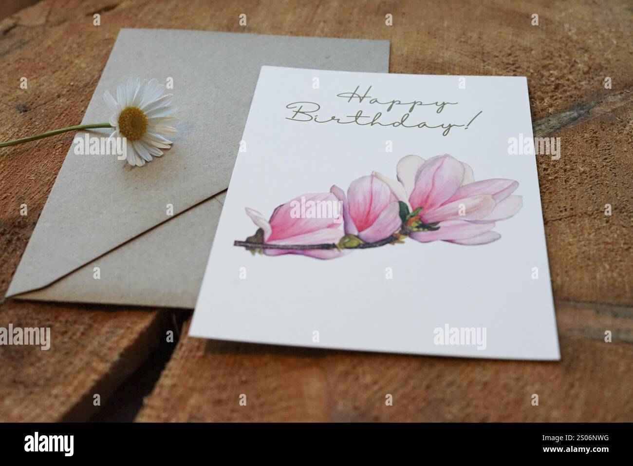 Happy birthday card with a magnolia branch painted in watercolour, with ...