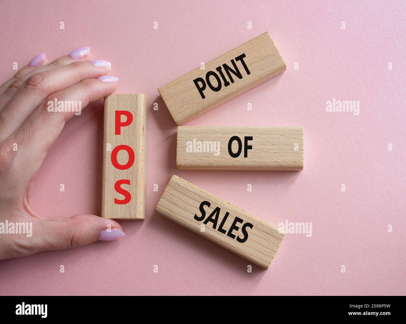 POS - Point Of Sales symbol. Wooden cubes with words POS. Businessman ...