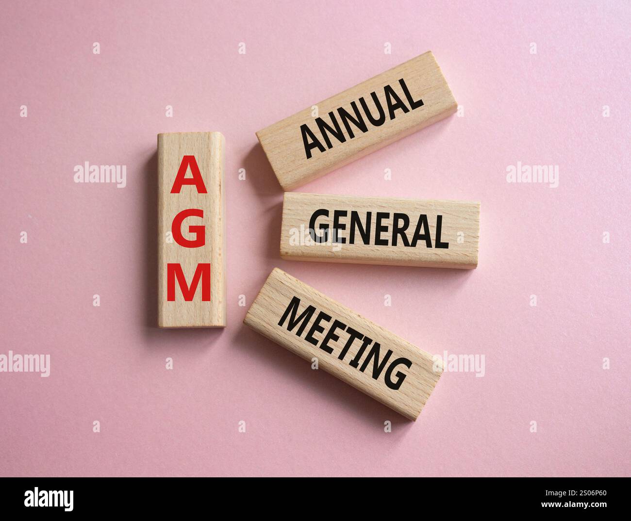 AGM - Annual general meeting symbol. Concept word AGM on wooden blocks ...