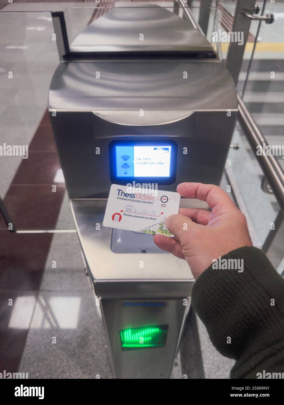 Thessaloniki, Greece - December 5 2024: A person uses a Thess Ticket ...
