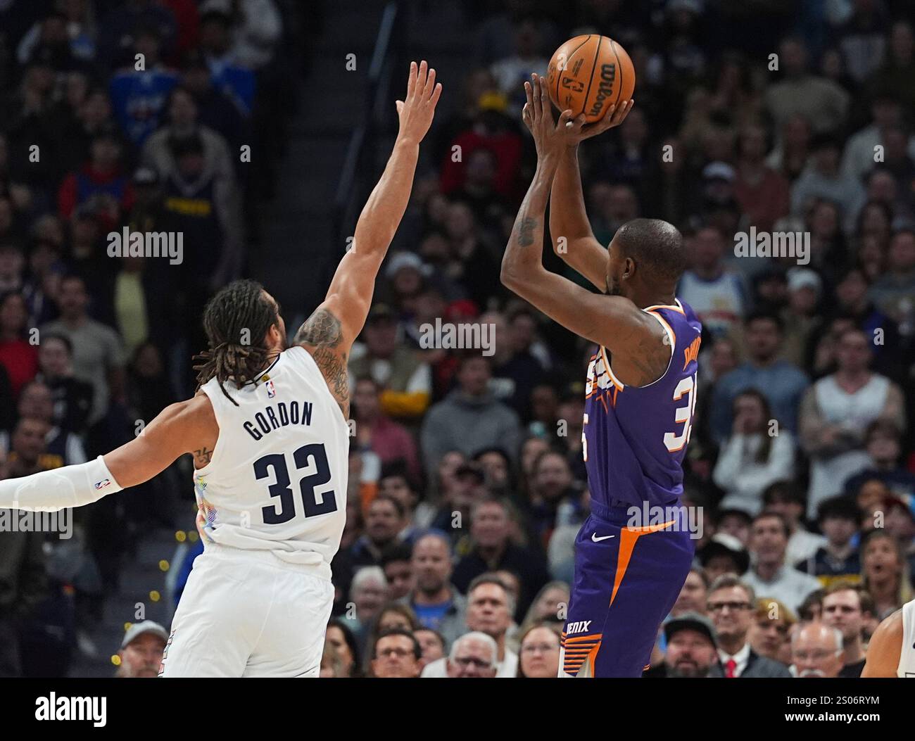 Phoenix Suns forward Kevin Durant (35) shoots as Denver Nuggets forward ...