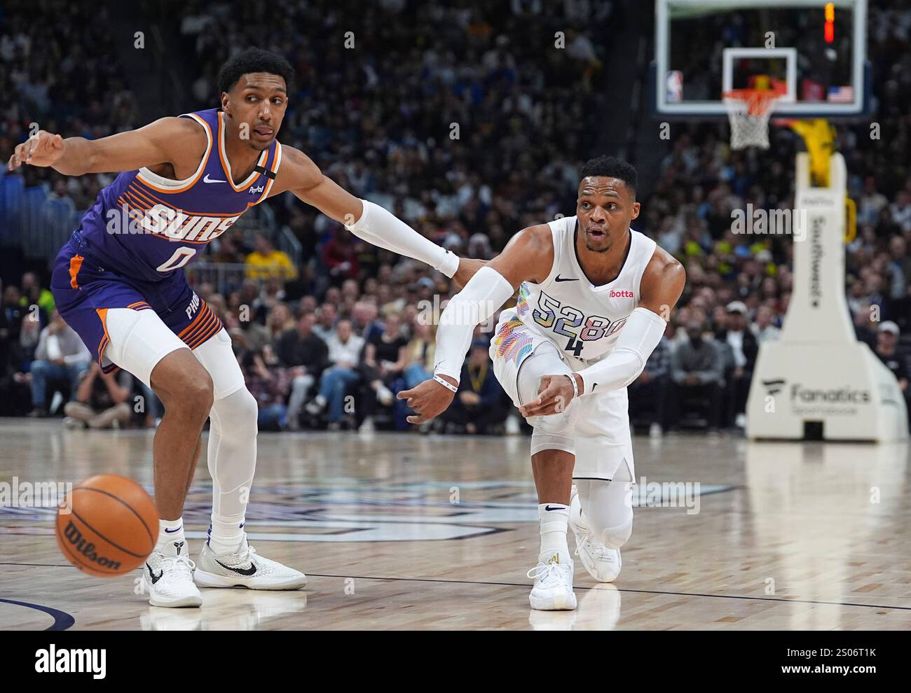 Denver Nuggets guard Russell Westbrook (4) passes the ball as Phoenix ...