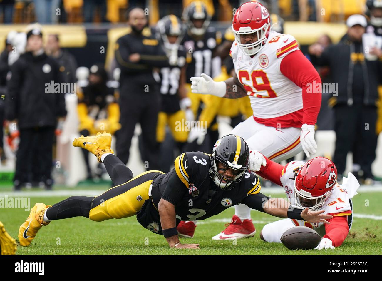 Pittsburgh Steelers quarterback Russell Wilson (3) reaches to recover ...